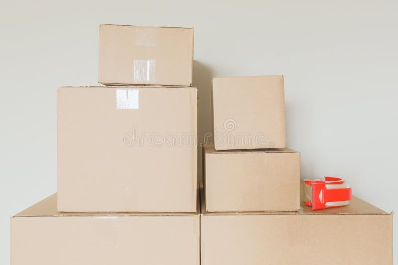 Variety of Packed Moving Boxes in Empty Room Stock Photo - Image of ...