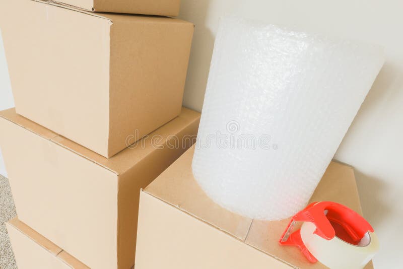 Variety of Packed Moving Boxes in Empty Room Stock Image - Image of ...
