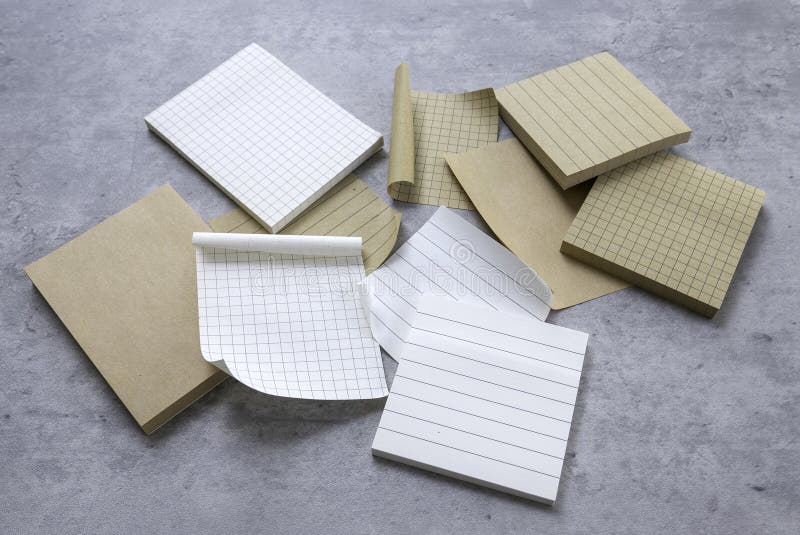 Variety of Paper Types: Lined, Grid, and Plain Sheets on a Gray Surface ...