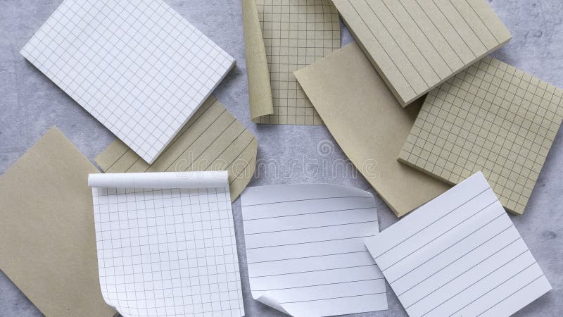 Variety of Paper Types: Lined, Grid, and Plain Sheets on a Gray Surface ...