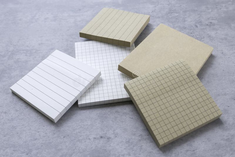 Variety of Paper Types: Lined, Grid, and Plain Sheets on a Gray Surface ...