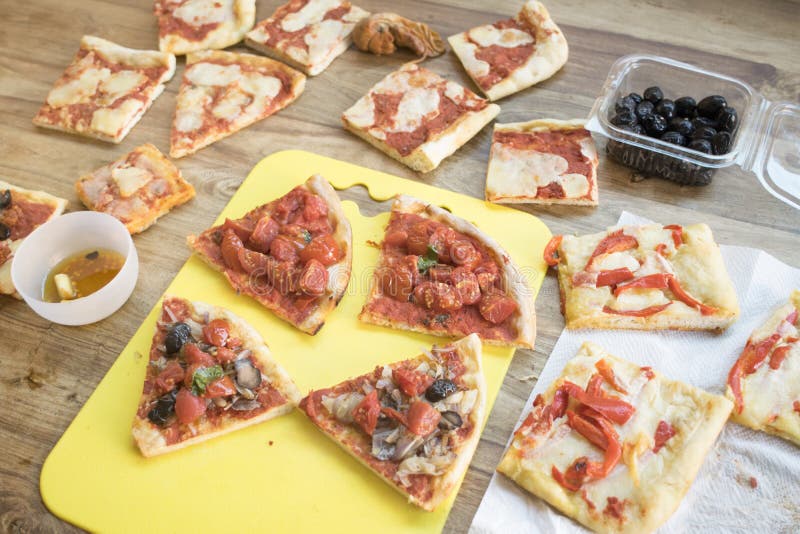 Variety of Pieces of Pizza on a Wooden Table Stock Image - Image of ...