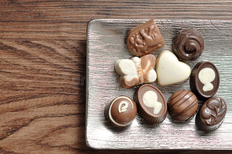 A Variety Of Small Chocolates Displayed In A Martini Glass Stock Photo ...