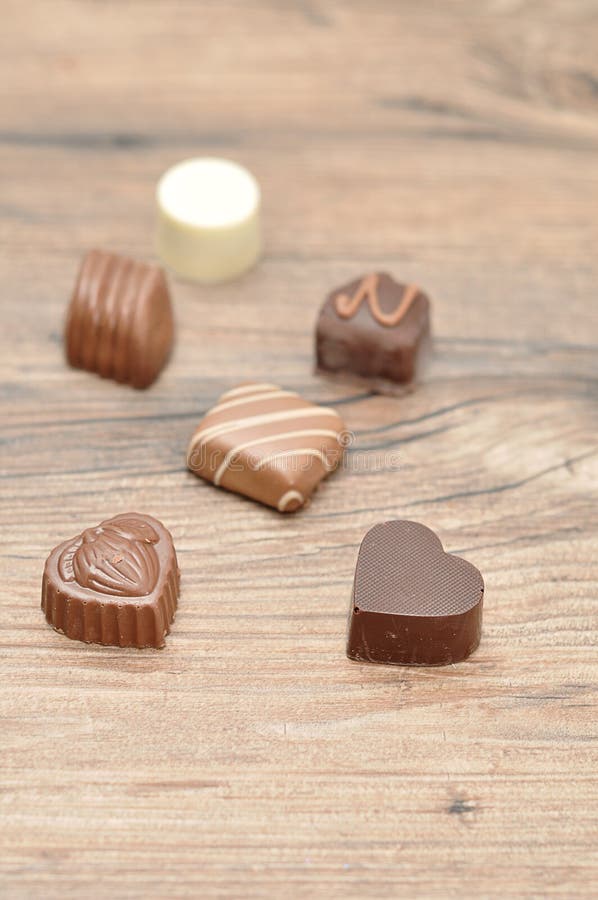 A Variety of Small Chocolates in a Row Stock Image - Image of ...