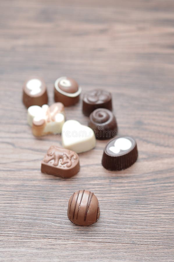 A Variety of Small Chocolates in a Row Stock Image - Image of ...