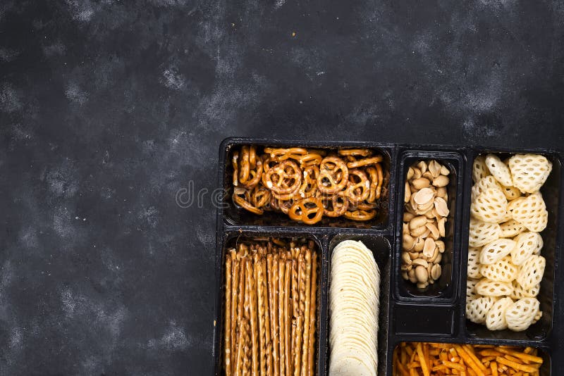 A Variety of Snacks on the Box for Beer on a Concrete Black Table Stock ...