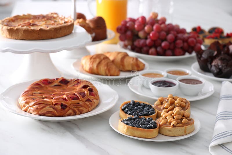 Variety of Snacks on White Marble Table in Buffet Style Stock Photo ...