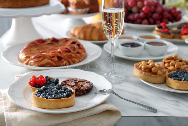 Variety of Snacks on White Marble Table in Buffet Style Stock Photo ...