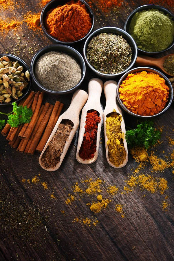 Variety of Spices on Wooden Kitchen Table Stock Photo - Image of taste ...
