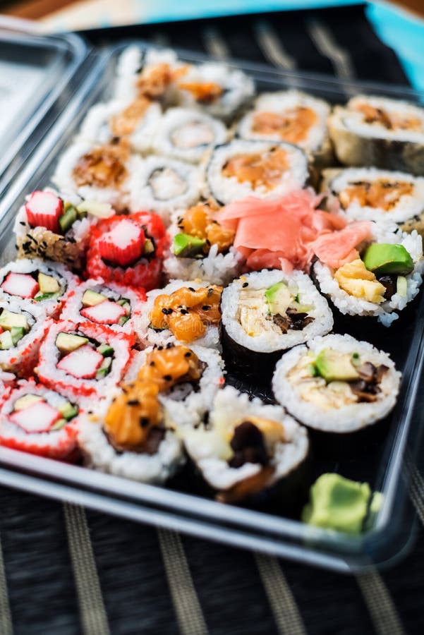 Variety of Sushi in a Delivery Box Stock Photo - Image of garnish ...