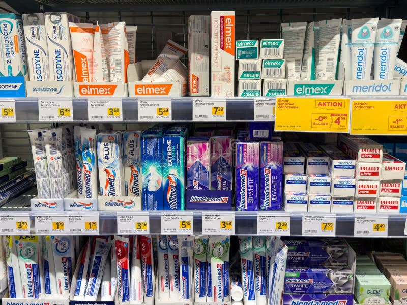 Variety of Toothpaste Brands on Store Shelf with Pricing Labels ...