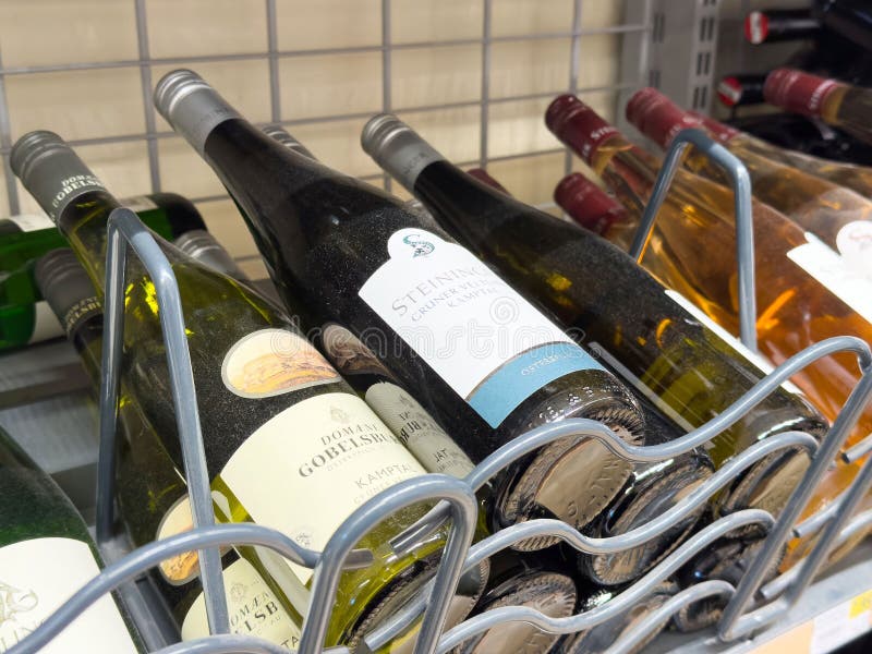 Variety of Wine Bottles on Store Shelf Displaying Labels and Caps ...