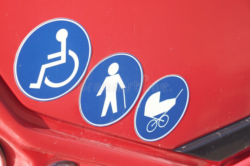 Various Accessibility Symbols Displayed on a Red Vehicle S Surface ...