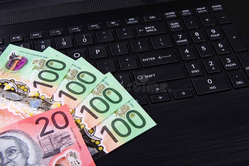 Various Bank Notes on a Computer Keyboard Stock Photo - Image of ...