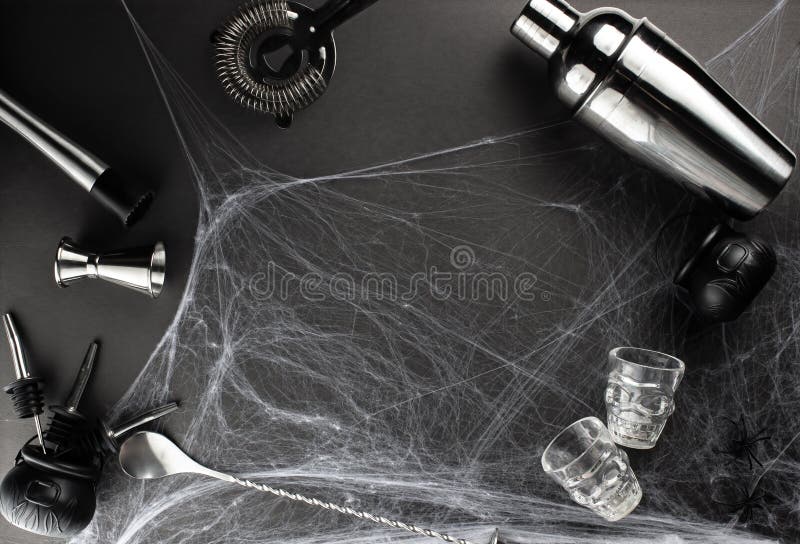 Various Bar Accessories Against the Backdrop of a Spider Web on a Black ...