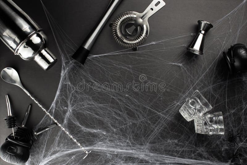 Various Bar Accessories Against the Backdrop of a Spider Web on a Black ...