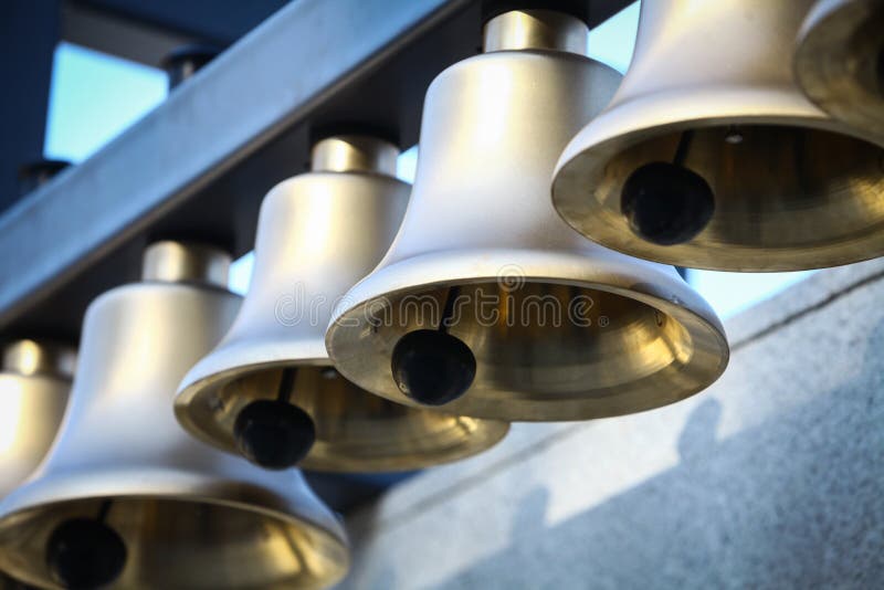 Various bells in a row stock image. Image of iron, golden - 64782841
