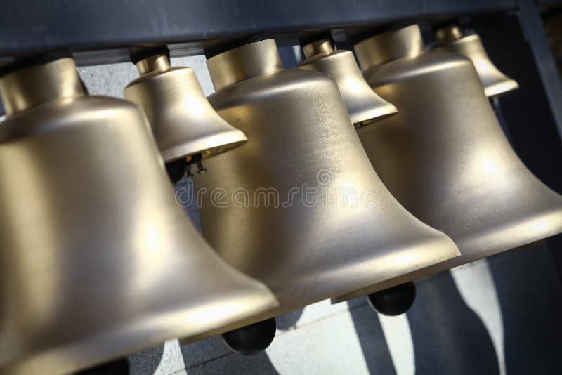 Various bells in a row stock photo. Image of group, iron - 64852510