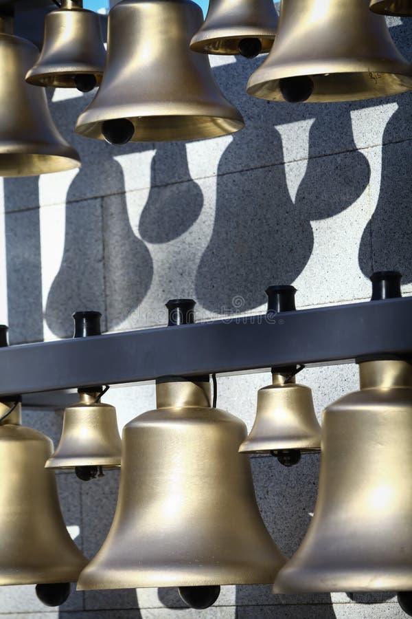 Various bells in a row stock image. Image of brass, classic - 64852709