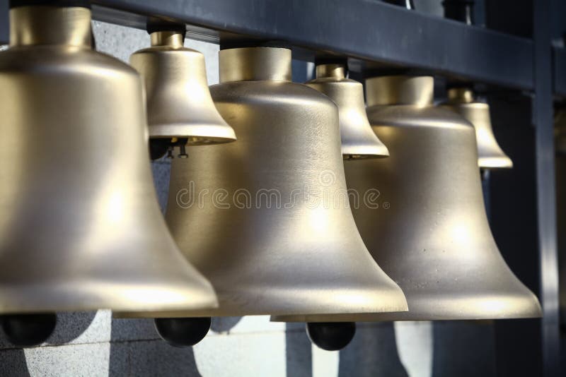 Various bells in a row stock image. Image of metal, brass - 64943201