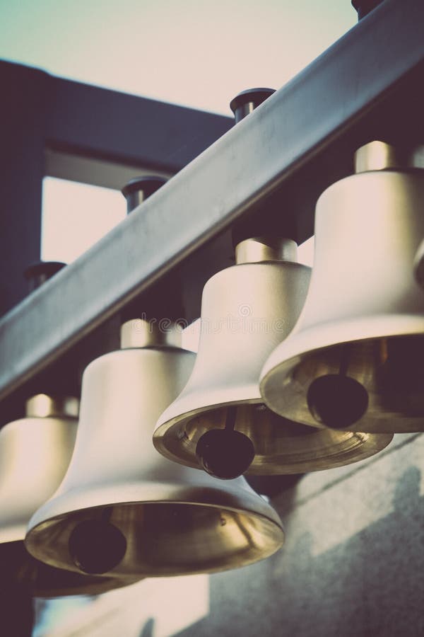 Various bells in a row stock photo. Image of bronze, alarm - 65902404