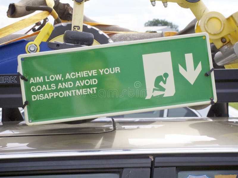 Sardonic Bittersweet Aim Low Sign Stock Photo - Image of disappoint ...