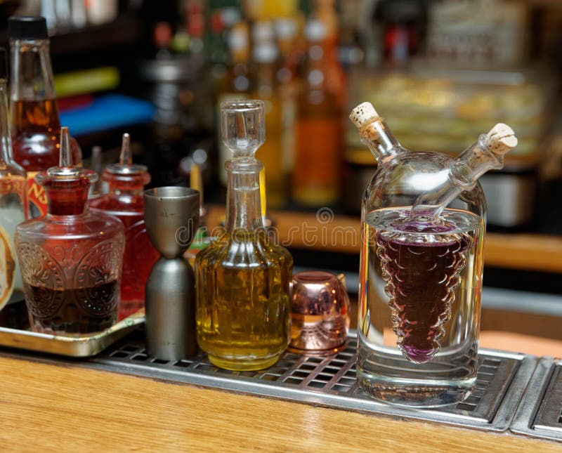 Various Alcohol Bottles in a Bar, Toned Stock Image - Image of ...