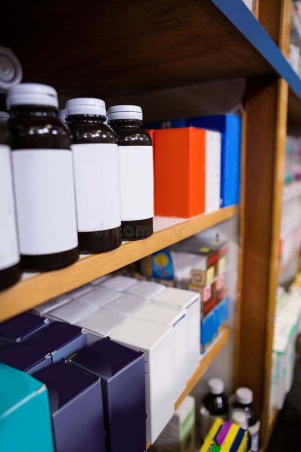 Various Boxes and Bottles of Medicine on Shelf Stock Image - Image of ...