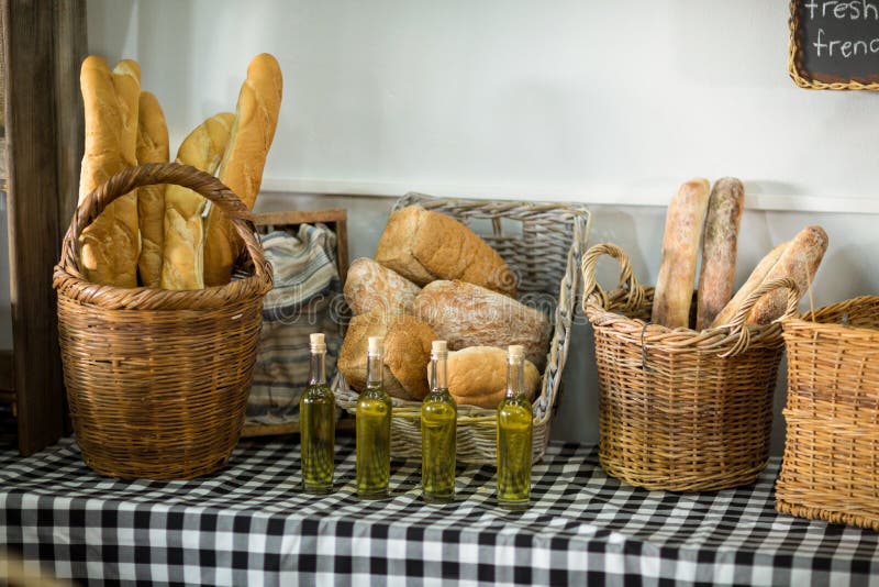 Various Bread and Bottle of Oil on Counter in Bake Shop Stock Photo ...
