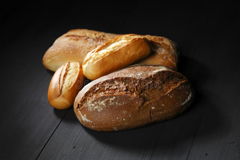 Various bread on table stock photo. Image of wood, bakery - 30021022