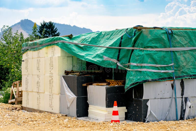 Various Building Materials and Fixtures Near a House Under Construction ...