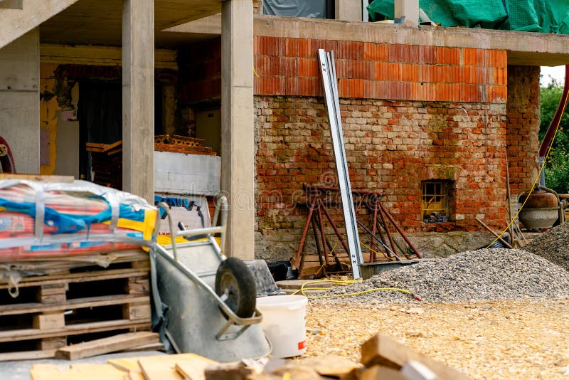 Various Building Materials and Fixtures Near a House Under Construction ...