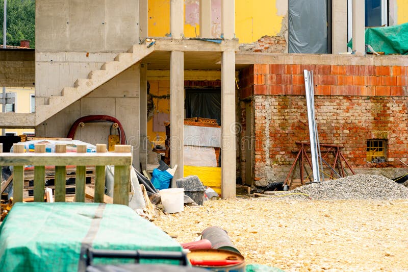 Various Building Materials and Fixtures Near a House Under Construction ...