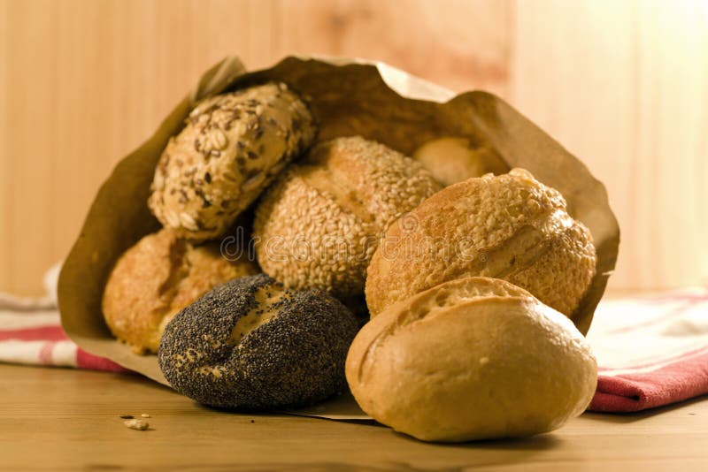 Various Buns Falling from Paper Bag Stock Image - Image of rolls, craft ...