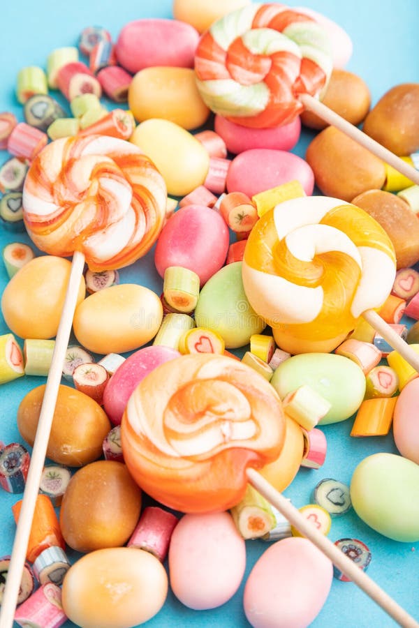 Various Caramel Candies on Blue Background. Side View Stock Photo ...