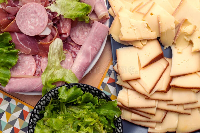Various Charcuterie and Cheese for Raclette Stock Photo - Image of ...
