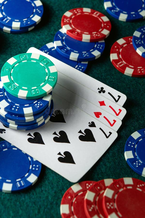 Various Chips and Playing Cards with a Combination of Four of a Kind or ...