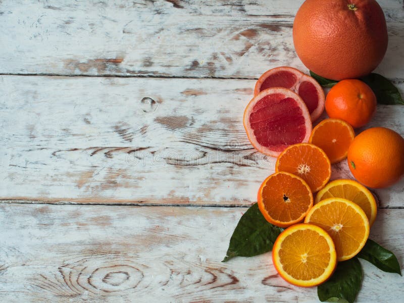 Various Citrus Fruits on Wooden Table. Free Space for Text Stock Photo ...