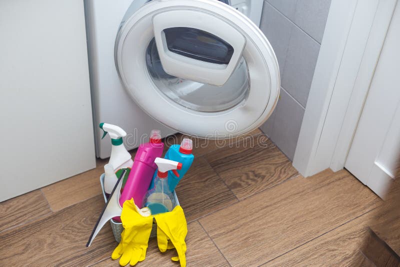 Various Cleaning Items and Supplies in a Bucket on the Bathroom. Stock ...