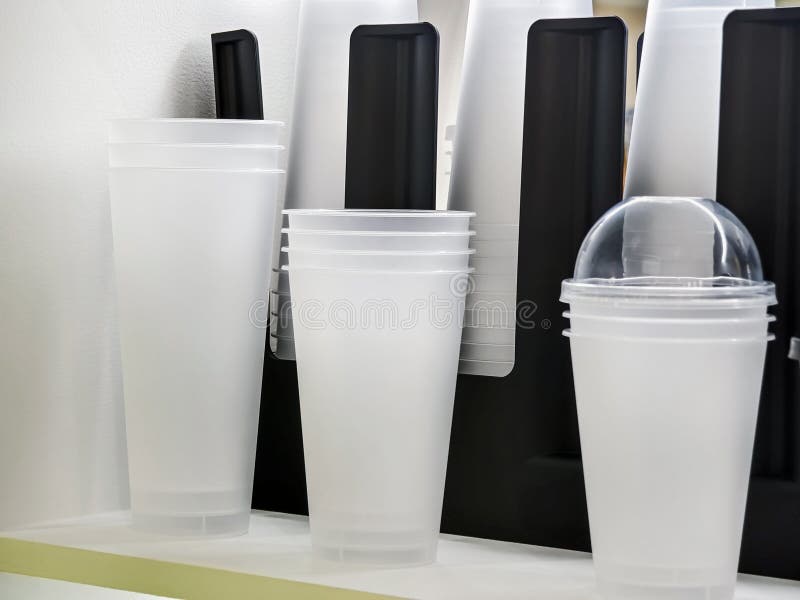 Various Clear and Opaque Disposable Cups Displayed on a Shelf in a Cafe ...