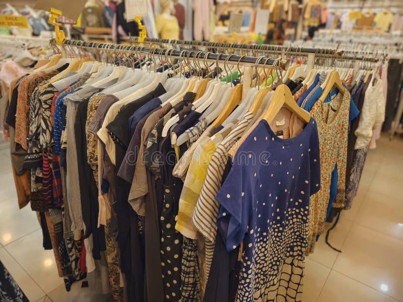 Various Clothes, Including Patterned and Solid Designs, Neatly Hung on ...