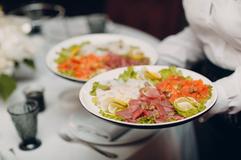 Various Cold Cuts on a Plate with White Flowers on Table Stock Image ...