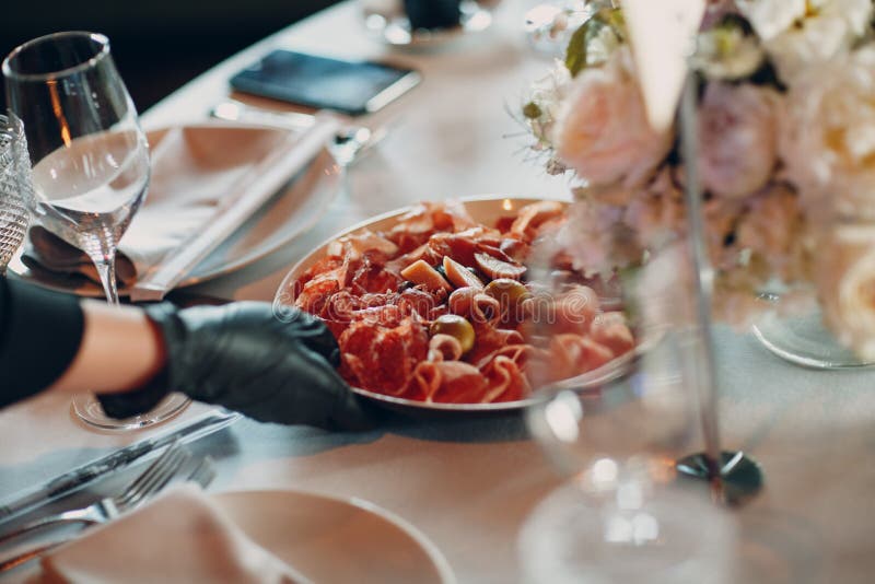 Various Cold Cuts on a Plate with White Flowers on Table Stock Image ...