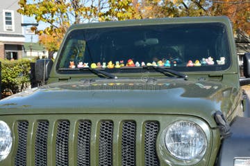 Various Colored Rubber Ducks on the Car Windshield Stock Image - Image ...