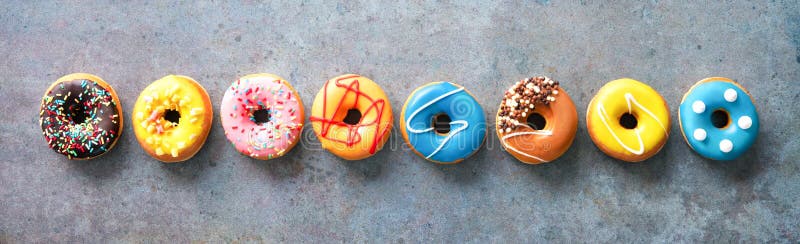 Various Colourful Donuts in a Row Stock Photo - Image of assorted, food ...