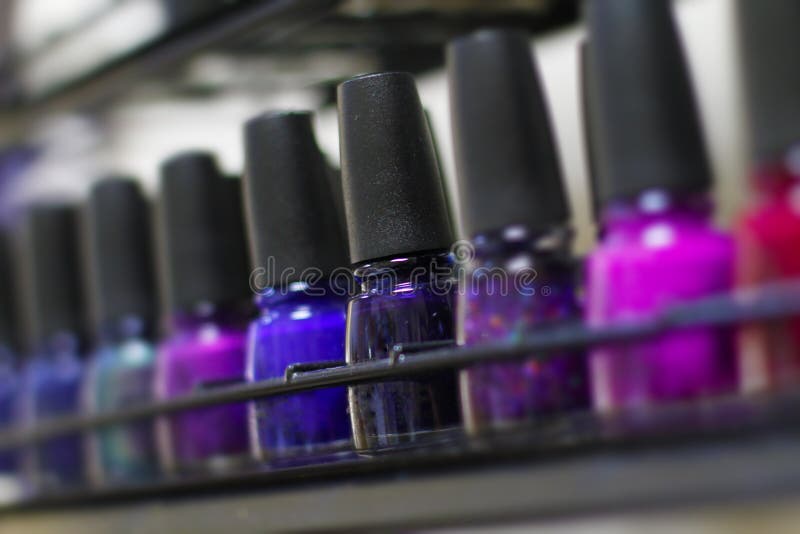 Nail polishes in a row stock image. Image of shelf, material - 114746865