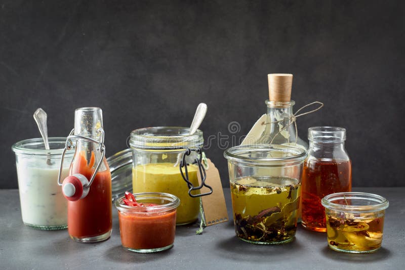 Various Condiments in Jars and Bottles Stock Photo - Image of chili ...