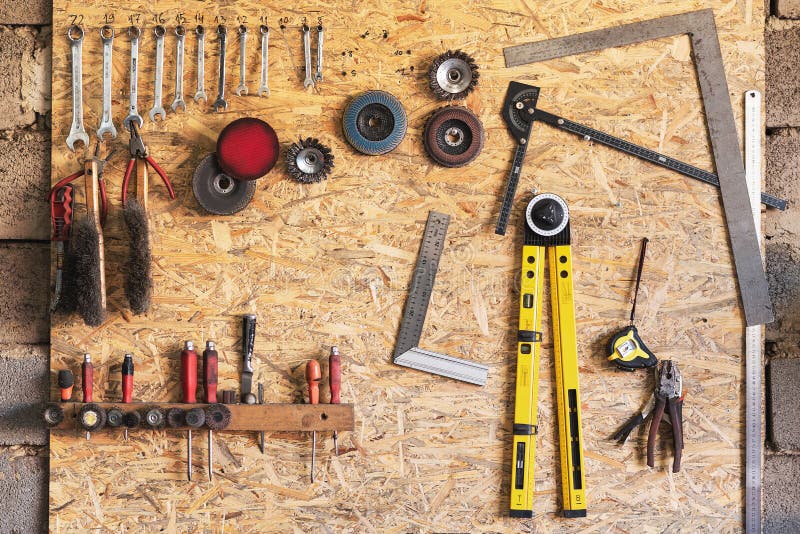 Various Construction Tools are Hanging on the Osb Board Stock Photo ...