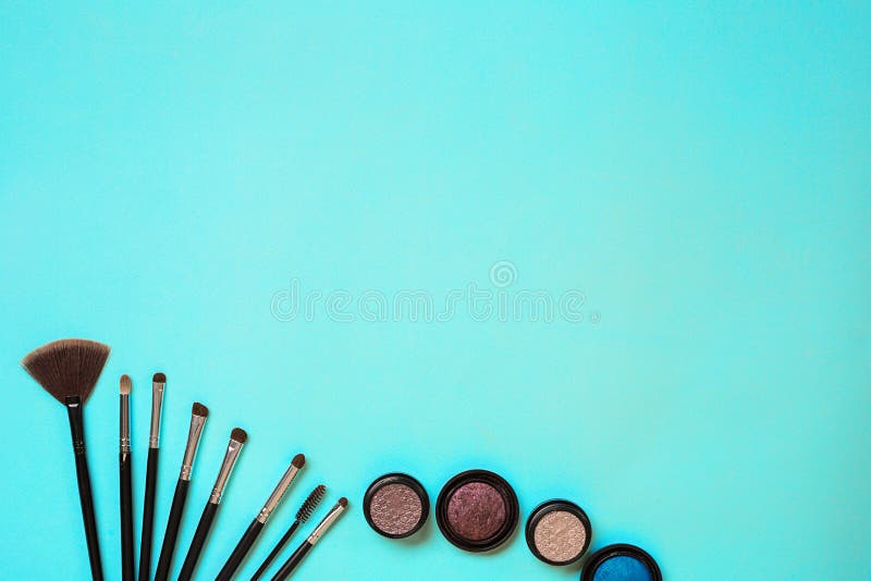 Various Cosmetics and Brushes on Blue Background Stock Image - Image of ...