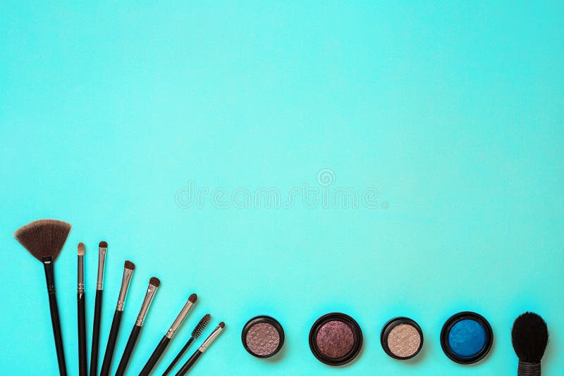 Various Cosmetics and Brushes on Blue Background Stock Image - Image of ...